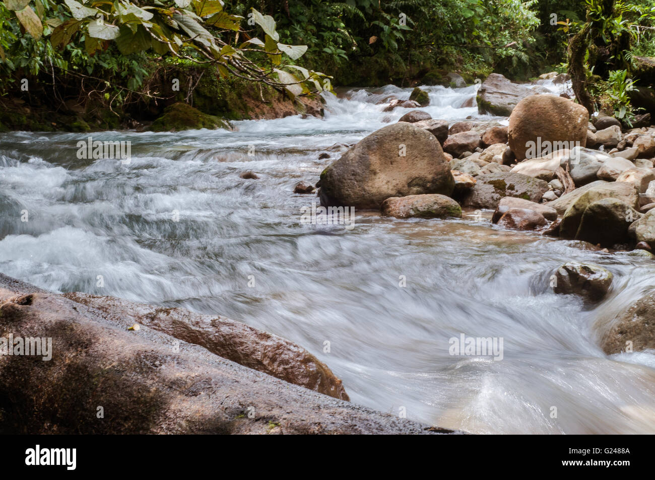 River Flowing Through the Rocks Stock Photo - Alamy