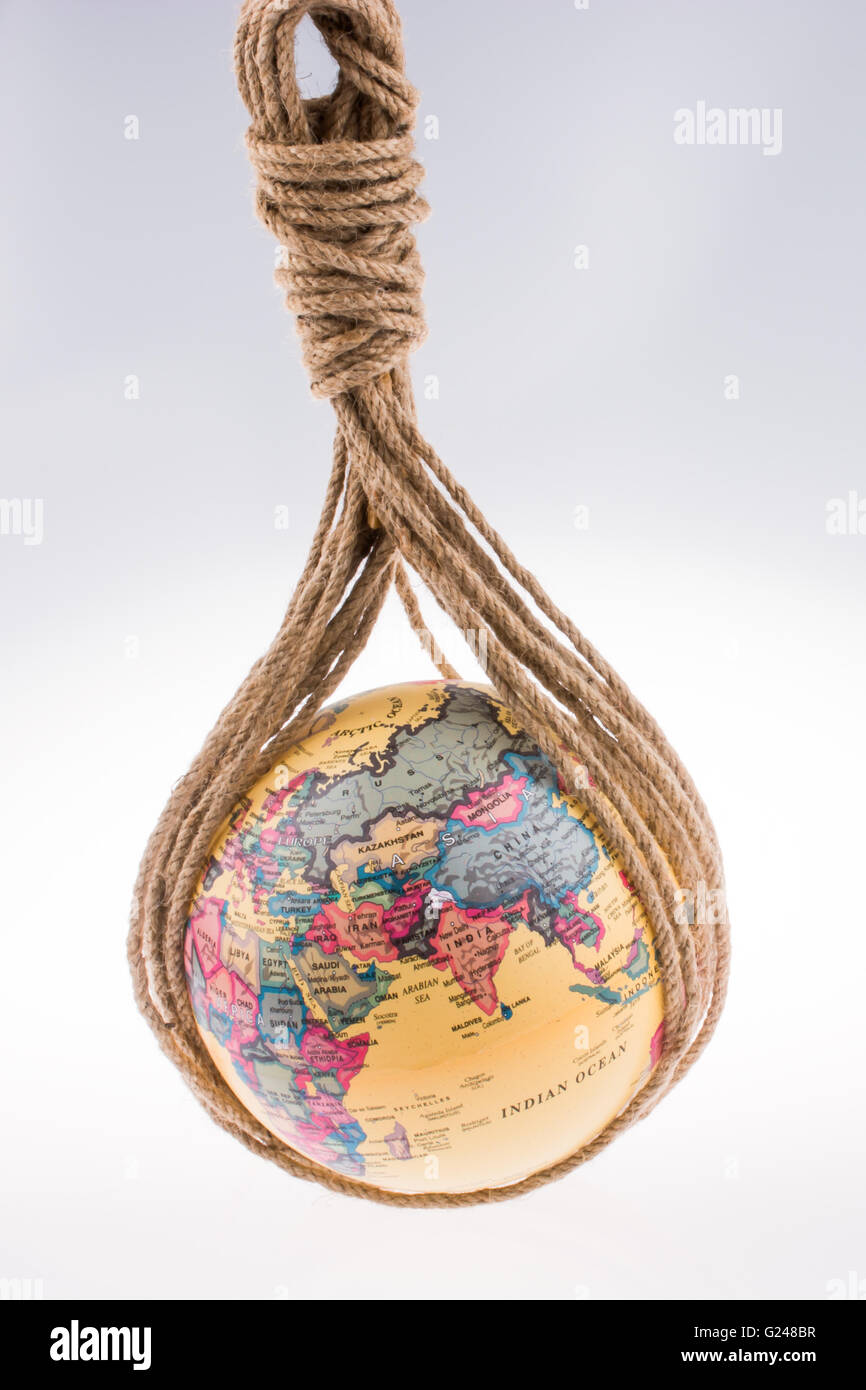 globe hanging in rope on white background Stock Photo - Alamy