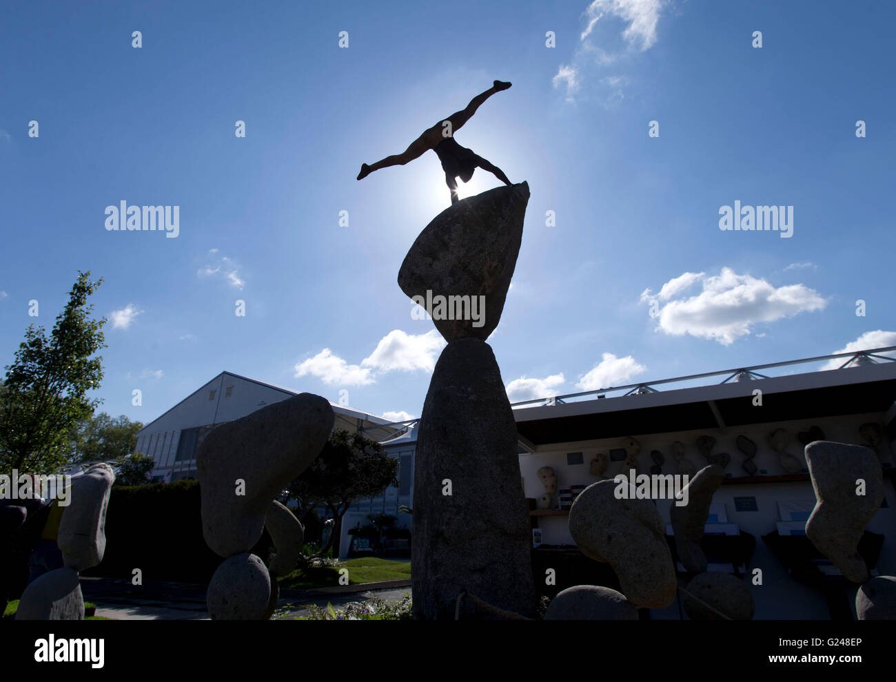 A gymnast balances on the Adrian Gray Stone balancing sculpture during ...