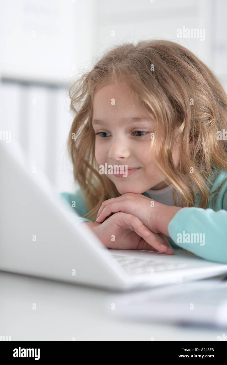 Little girl using computer Stock Photo - Alamy