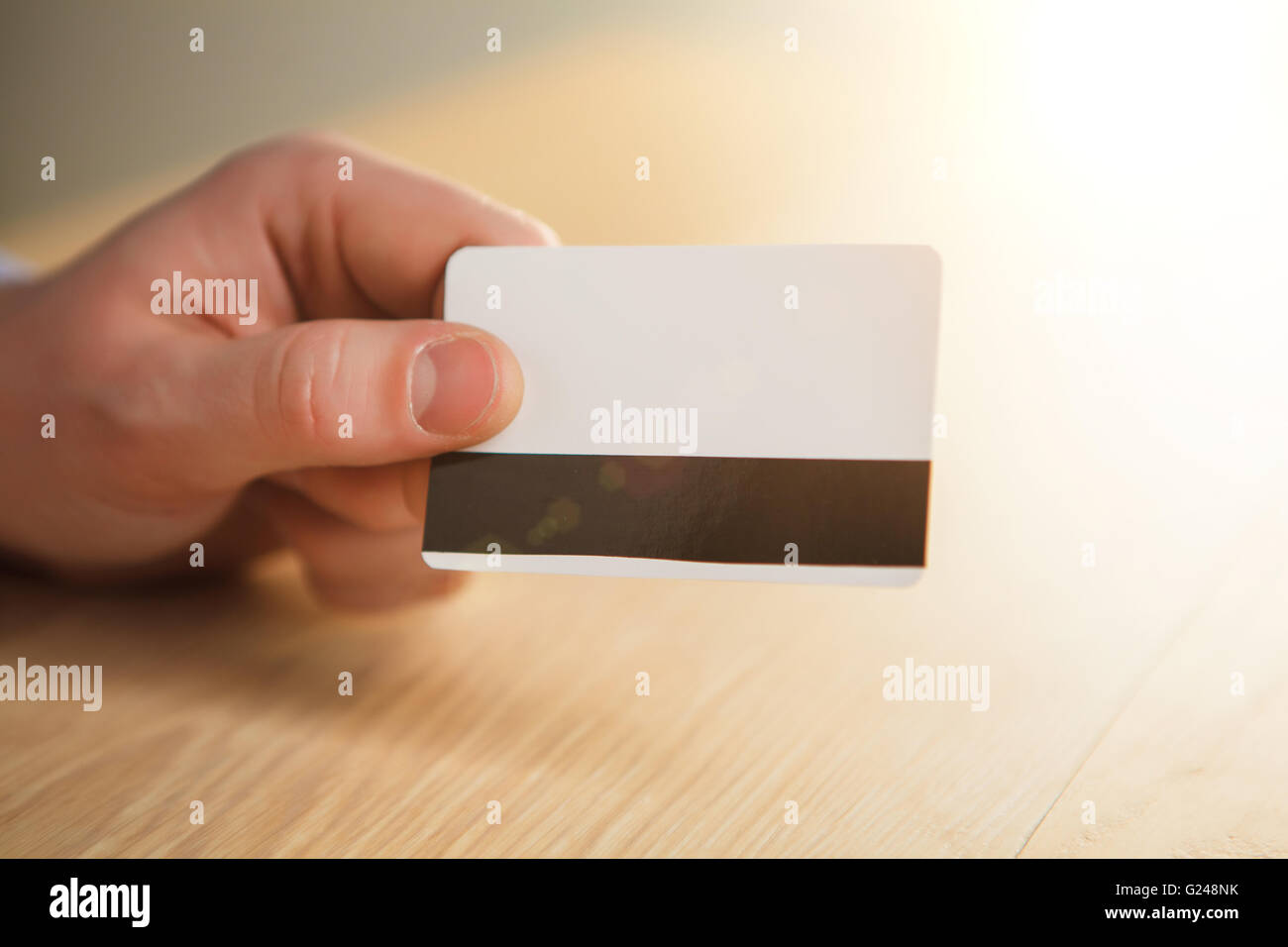 The male hand showing credit card Stock Photo - Alamy
