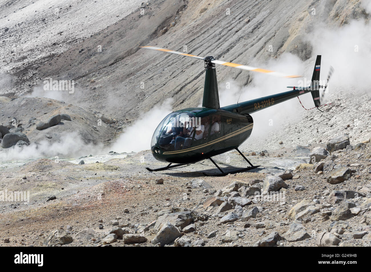 Touristic Helicopter Robinson R44 Raven with travelers and tourists on ...