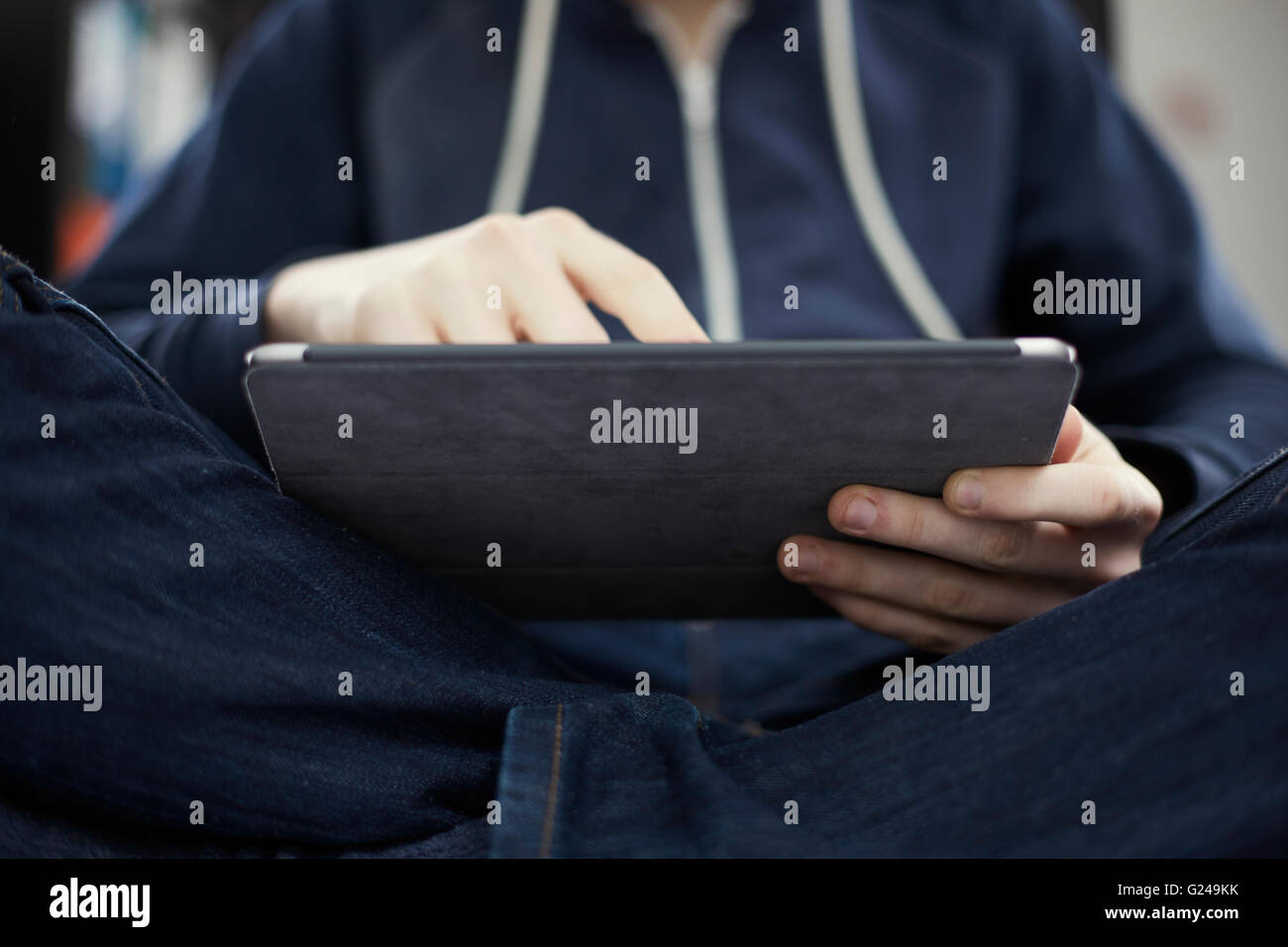 Ipad sitting hi-res stock photography and images - Alamy