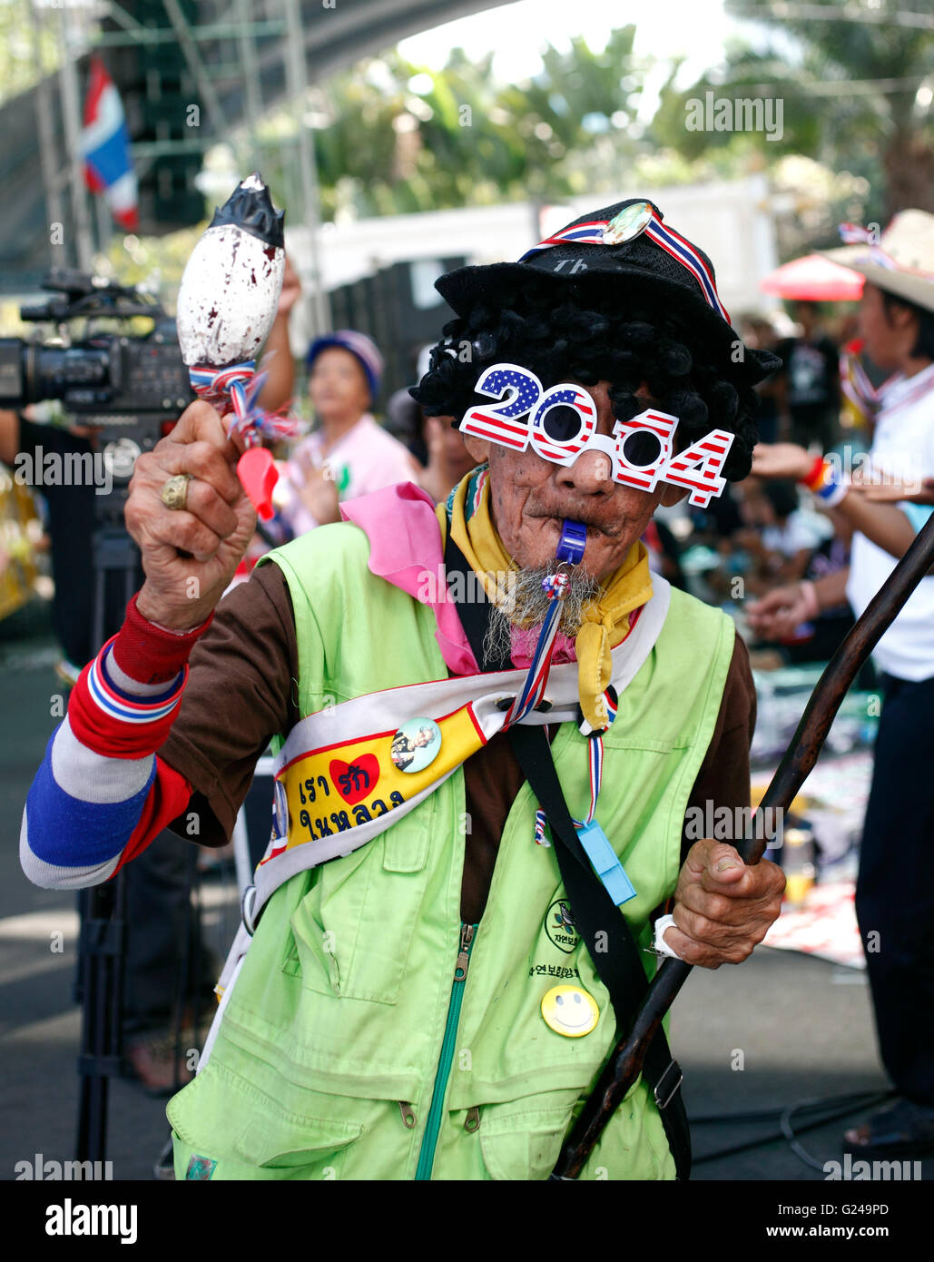Old man with a whistle dancing amongst the protesters, political ...