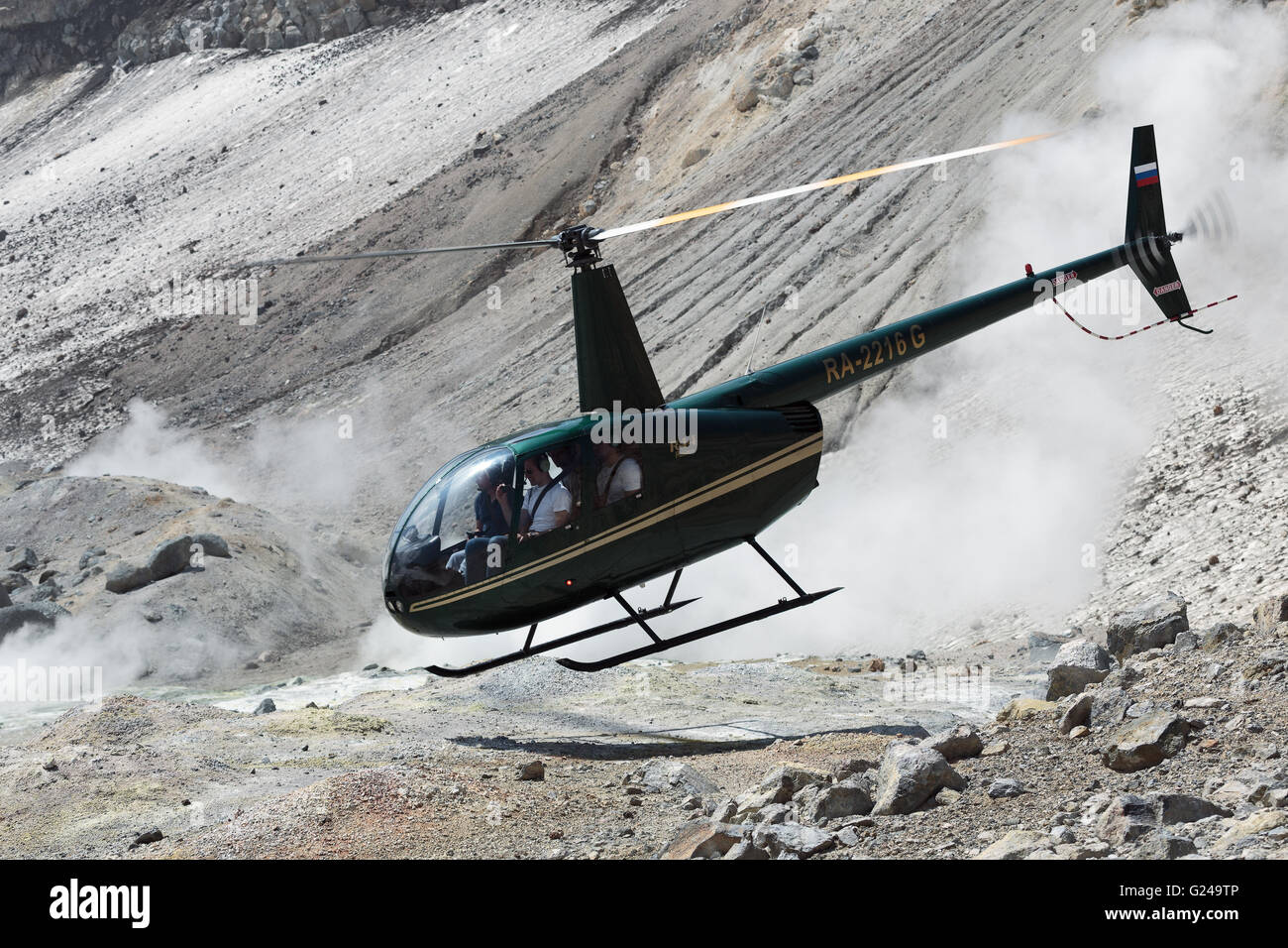 View of touristic Helicopter Robinson R44 Raven with tourists on board ...