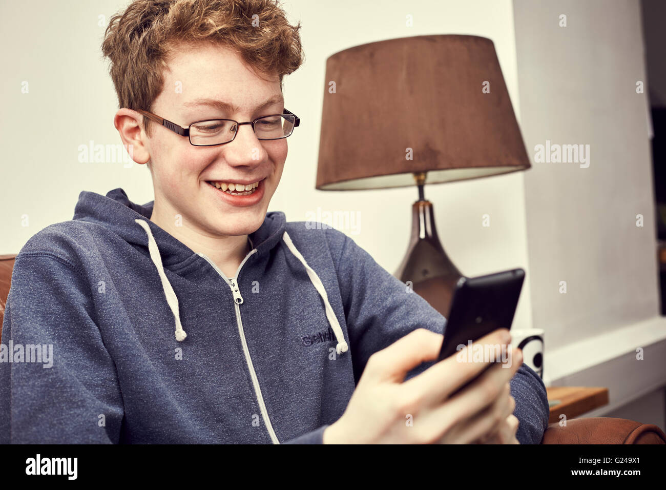 Smiley teenager hi-res stock photography and images - Alamy