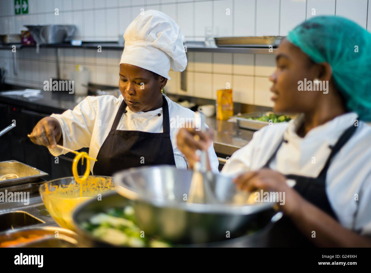 Chefs prepare dishes for lunch at NICE restaurant, Windhoek, Namibia ...
