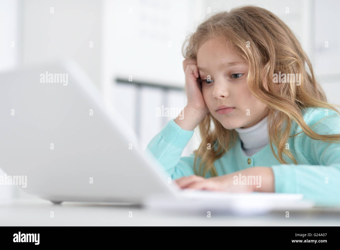 Little girl using computer Stock Photo - Alamy