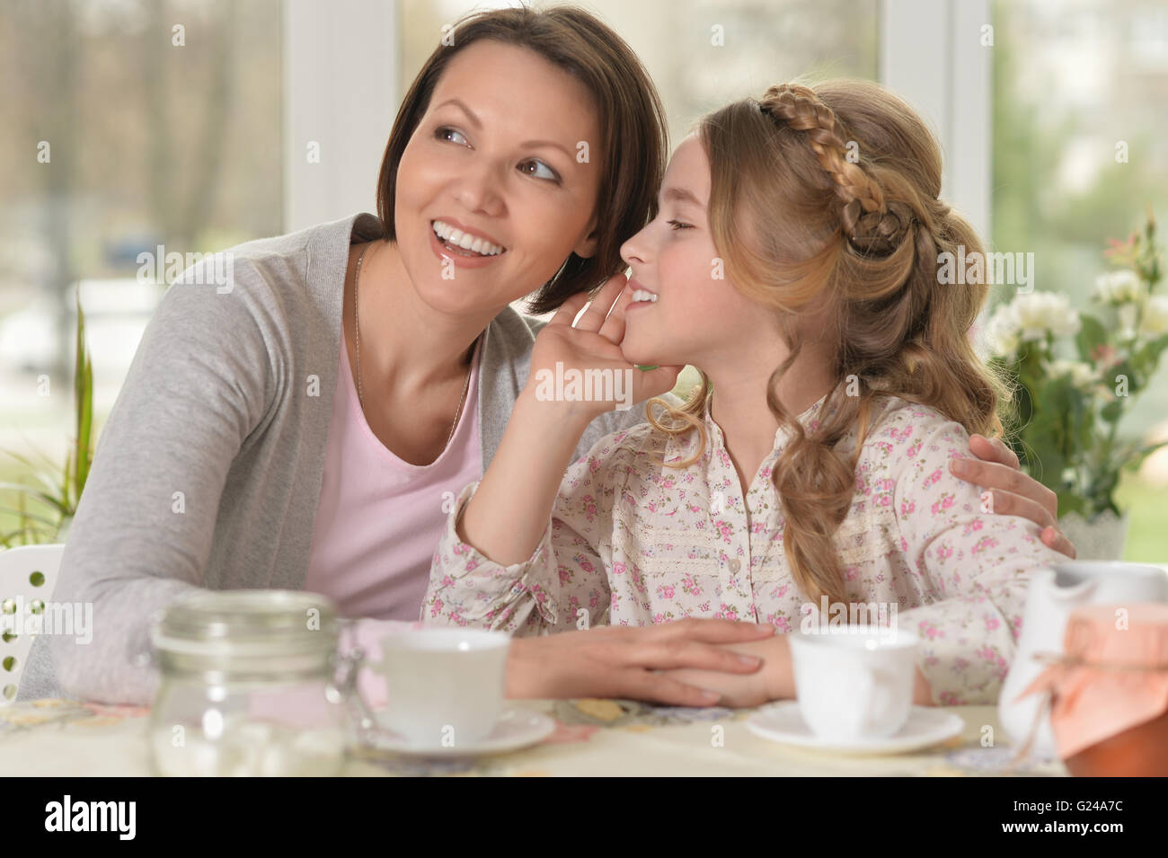 little girl telling a secret Stock Photo - Alamy