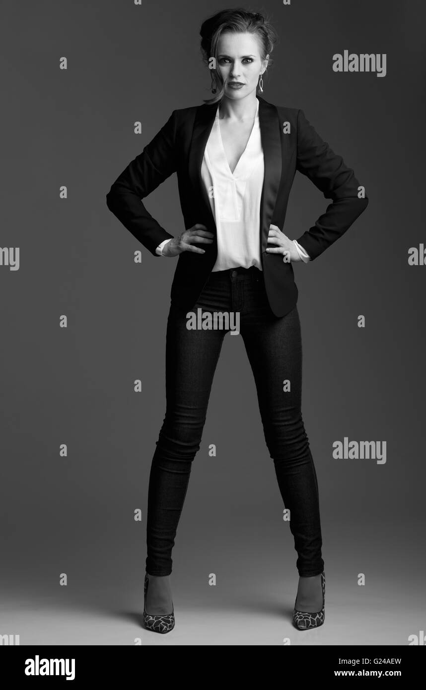 Contemporary woman in black and white aesthetic. Full length portrait ...