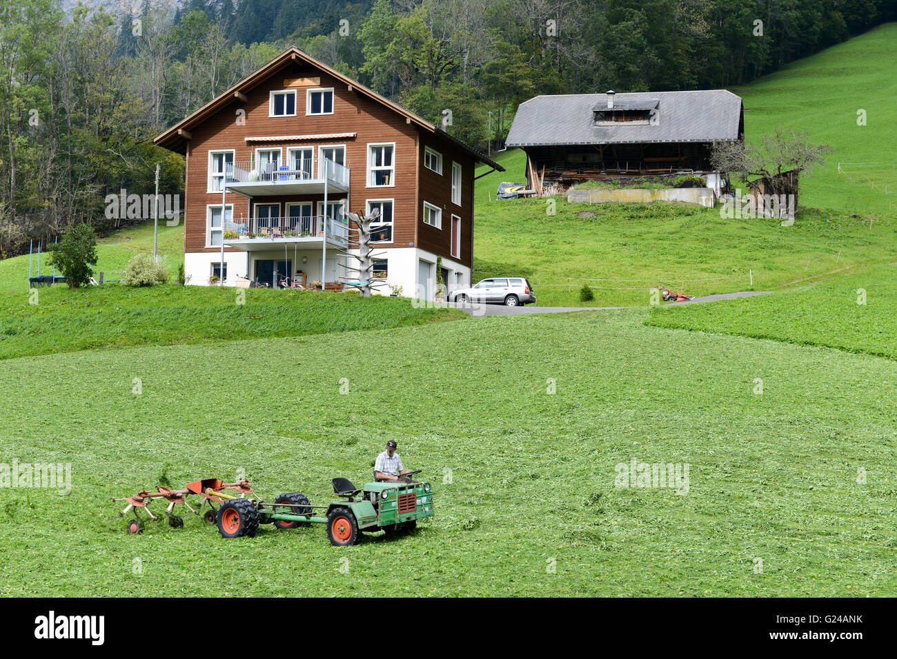 Swiss farmer on tractor hi-res stock photography and images - Alamy