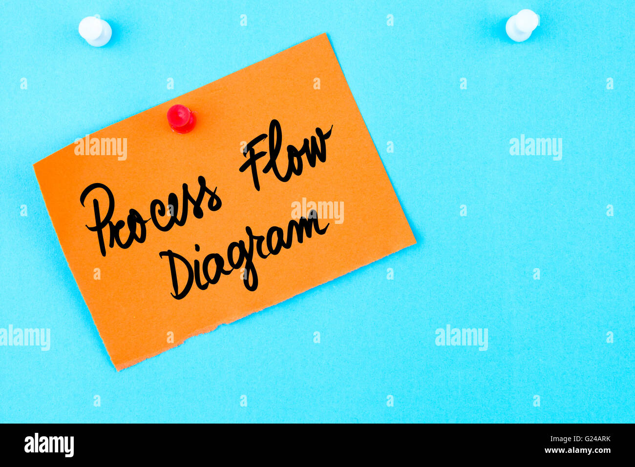 Process Flow Diagram written on orange paper note pinned on cork board ...