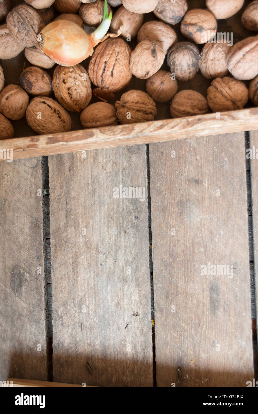 food background, fresh walnuts in a wooden box Stock Photo - Alamy