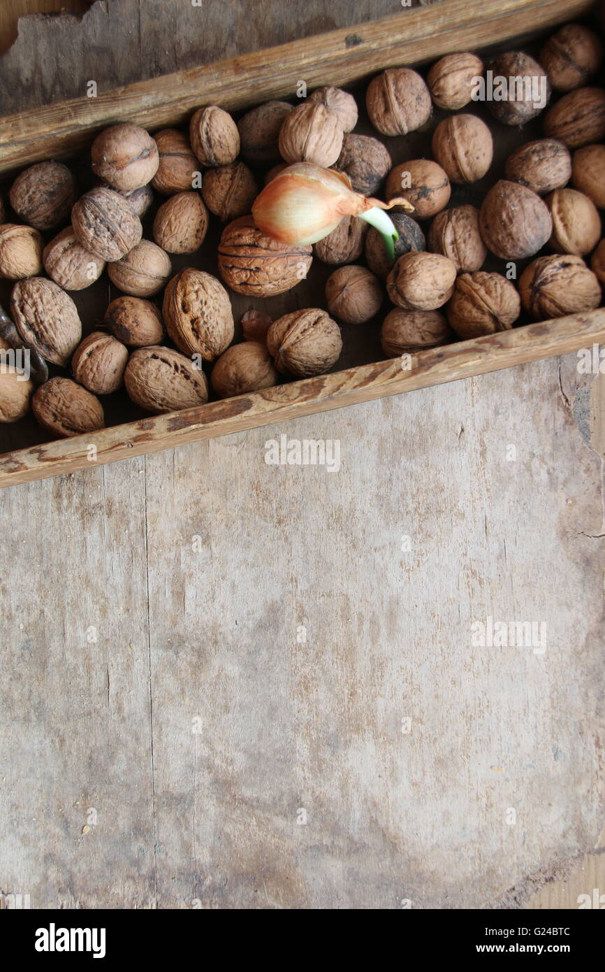food background, fresh walnuts in a wooden box Stock Photo - Alamy