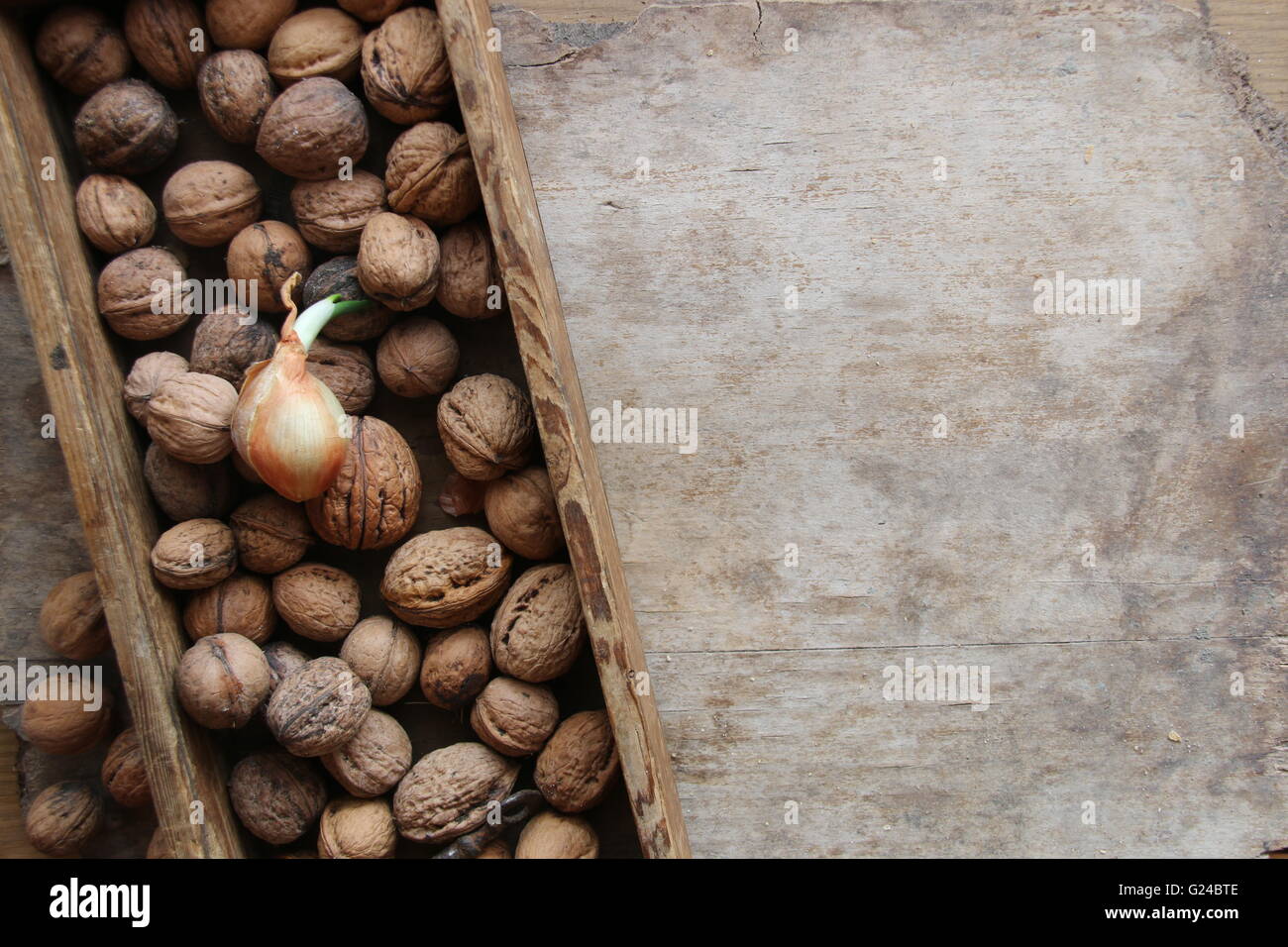 food background, fresh walnuts in a wooden box Stock Photo - Alamy