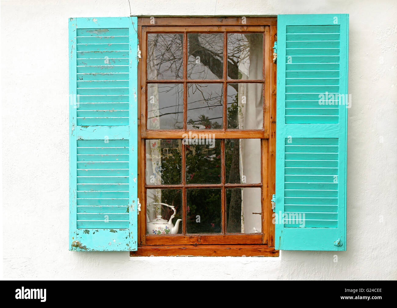 A fancy china teapot in the window of a Bermuda home Stock Photo - Alamy