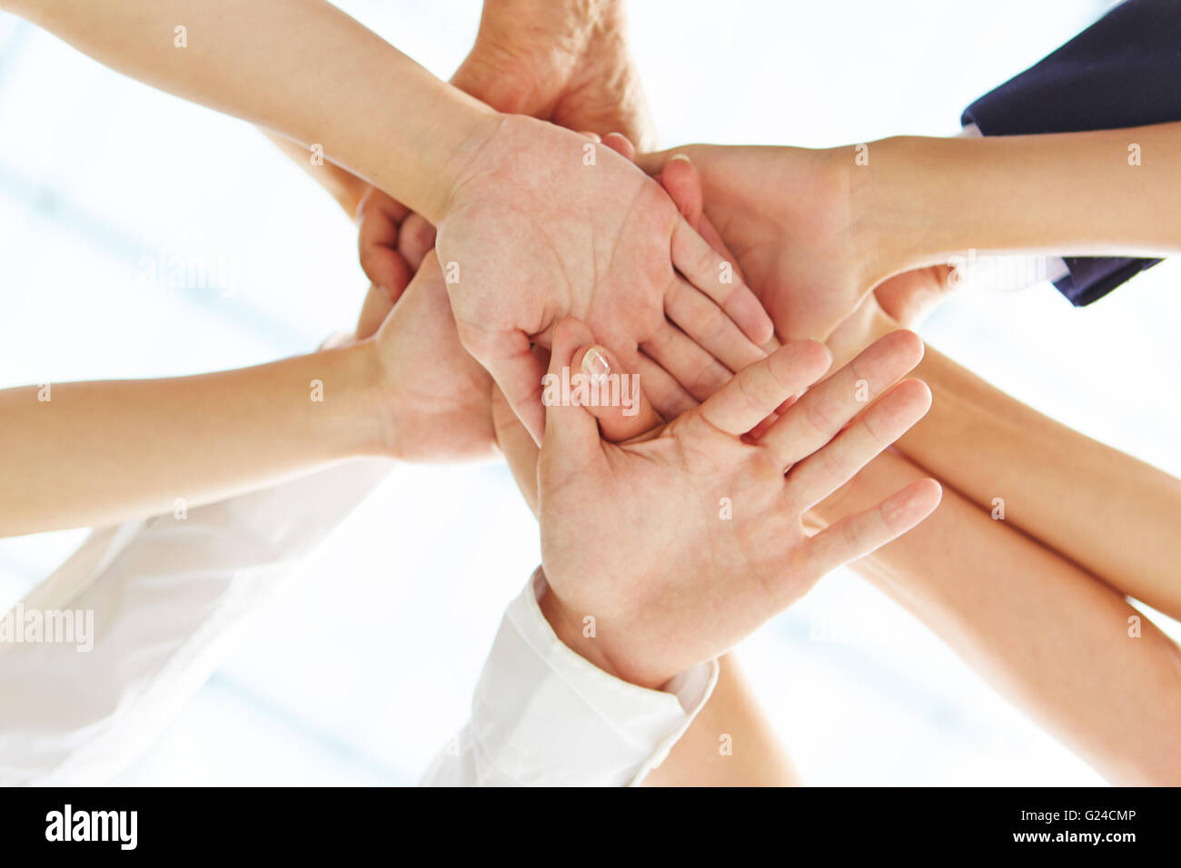 Many hands stacked as concept for motivation and teamwork Stock Photo ...