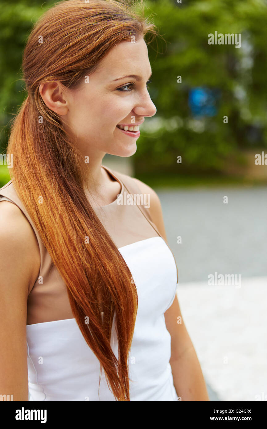 Woman standing sideways profile hi-res stock photography and images - Alamy