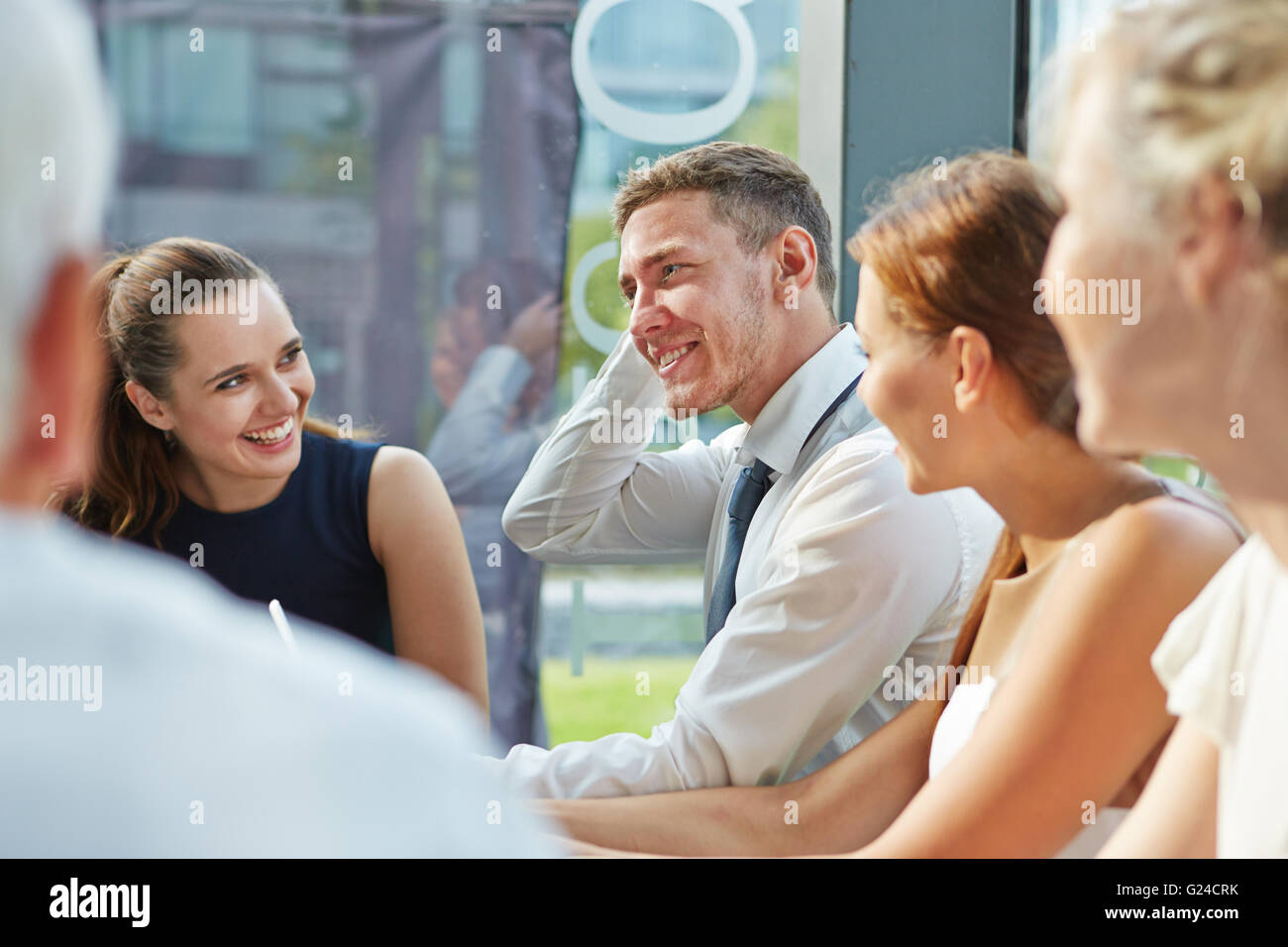 Many business people talking to each other in a team meeting Stock ...