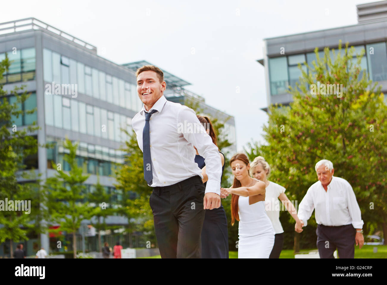 Business people running together hi-res stock photography and images ...
