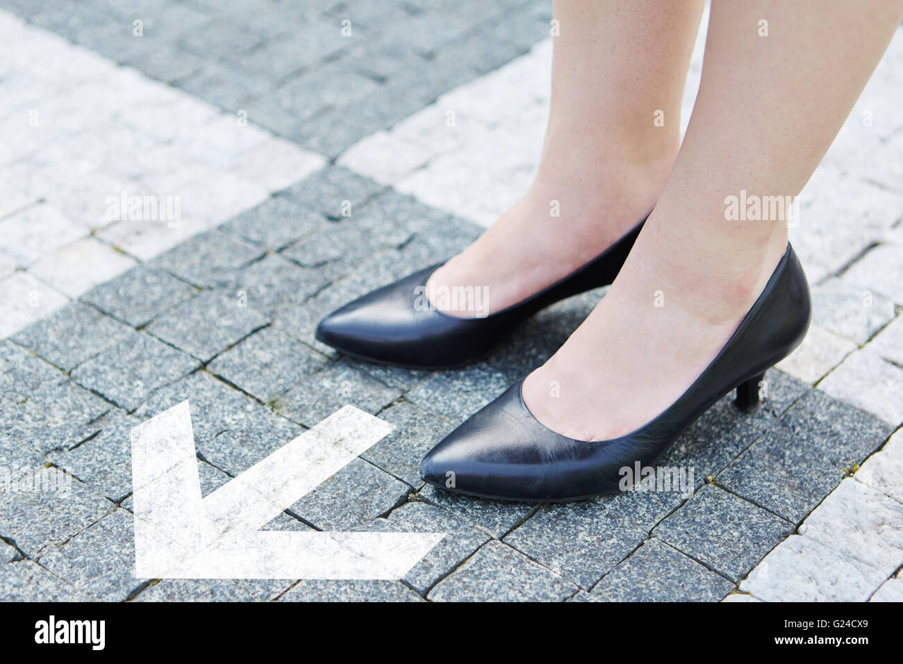 Arrow as concept for success through decision with female shoes on ...