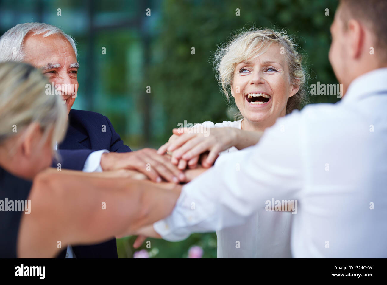 Many stacked hands teamwork concept hi-res stock photography and images ...