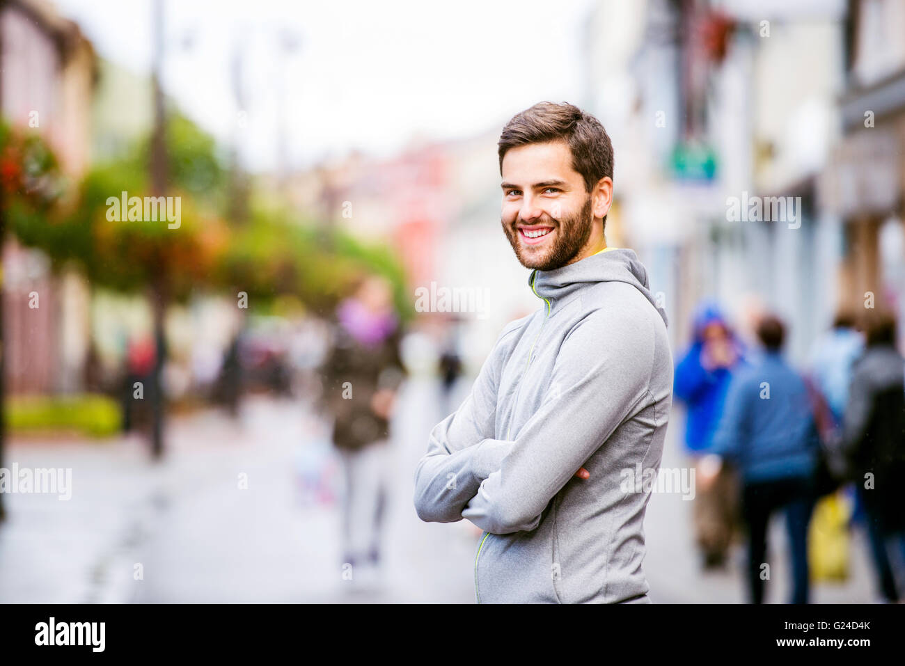 Young hipster man running in town, resting Stock Photo - Alamy