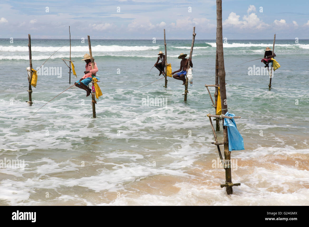 Traditional stick fisherman in the sea near Weligama on the south coast ...