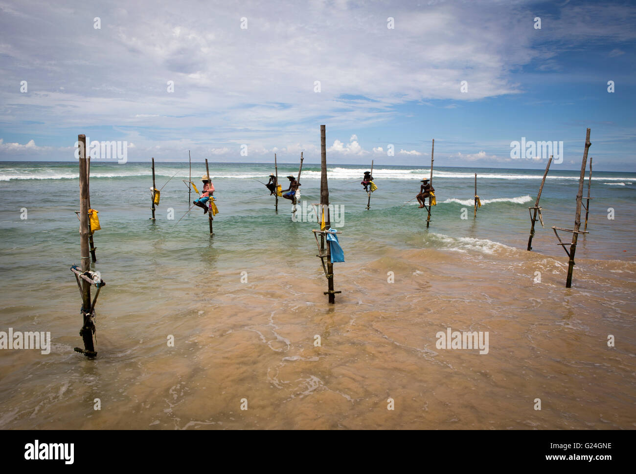 Traditional stick fisherman in the sea near Weligama on the south coast ...