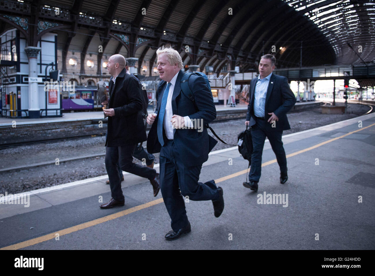 Former Mayor Boris Johnson (centre) runs for a train at York Railway ...