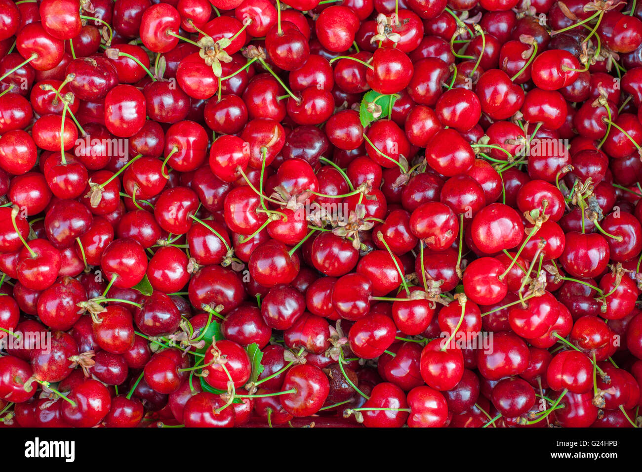Fresh red cherries background texture hi-res stock photography and ...