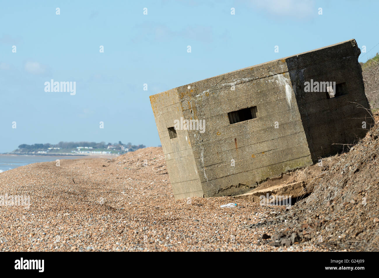 Second World War pillbox, slipped from the clifftop down onto the beach ...