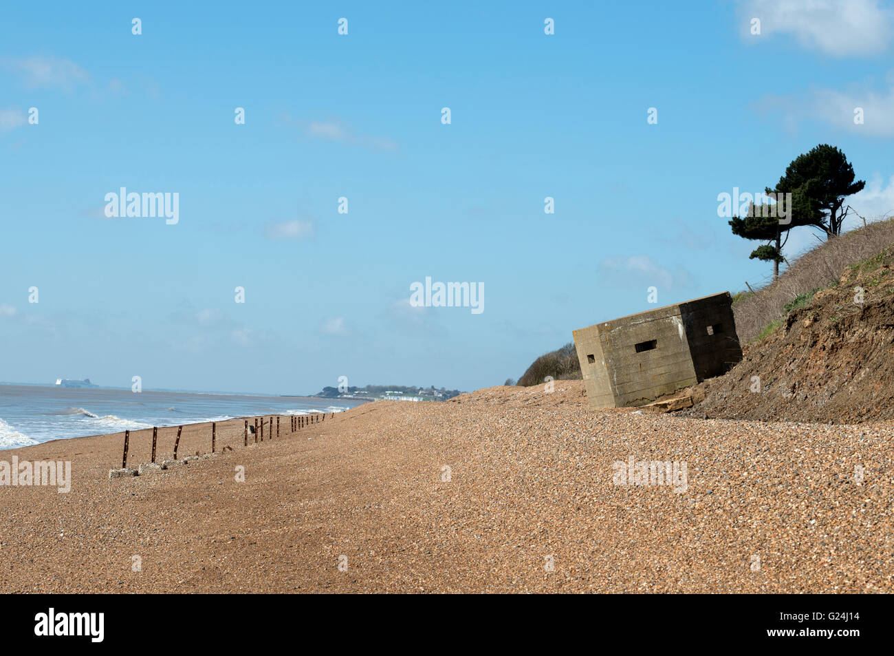 Second World War pillbox, slipped from the clifftop down onto the beach ...
