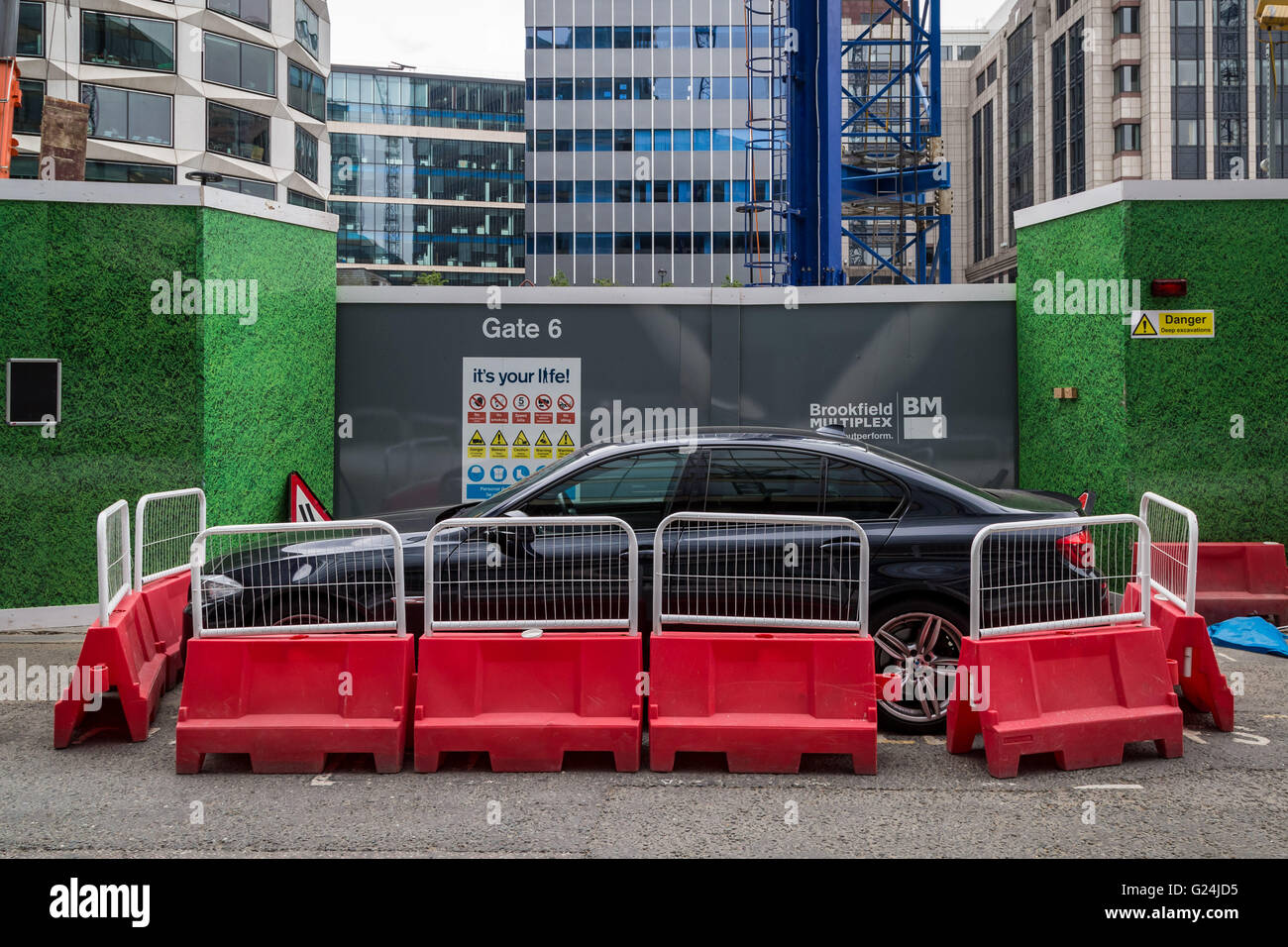 Protected car near building construction site. Liverpool Street, London ...