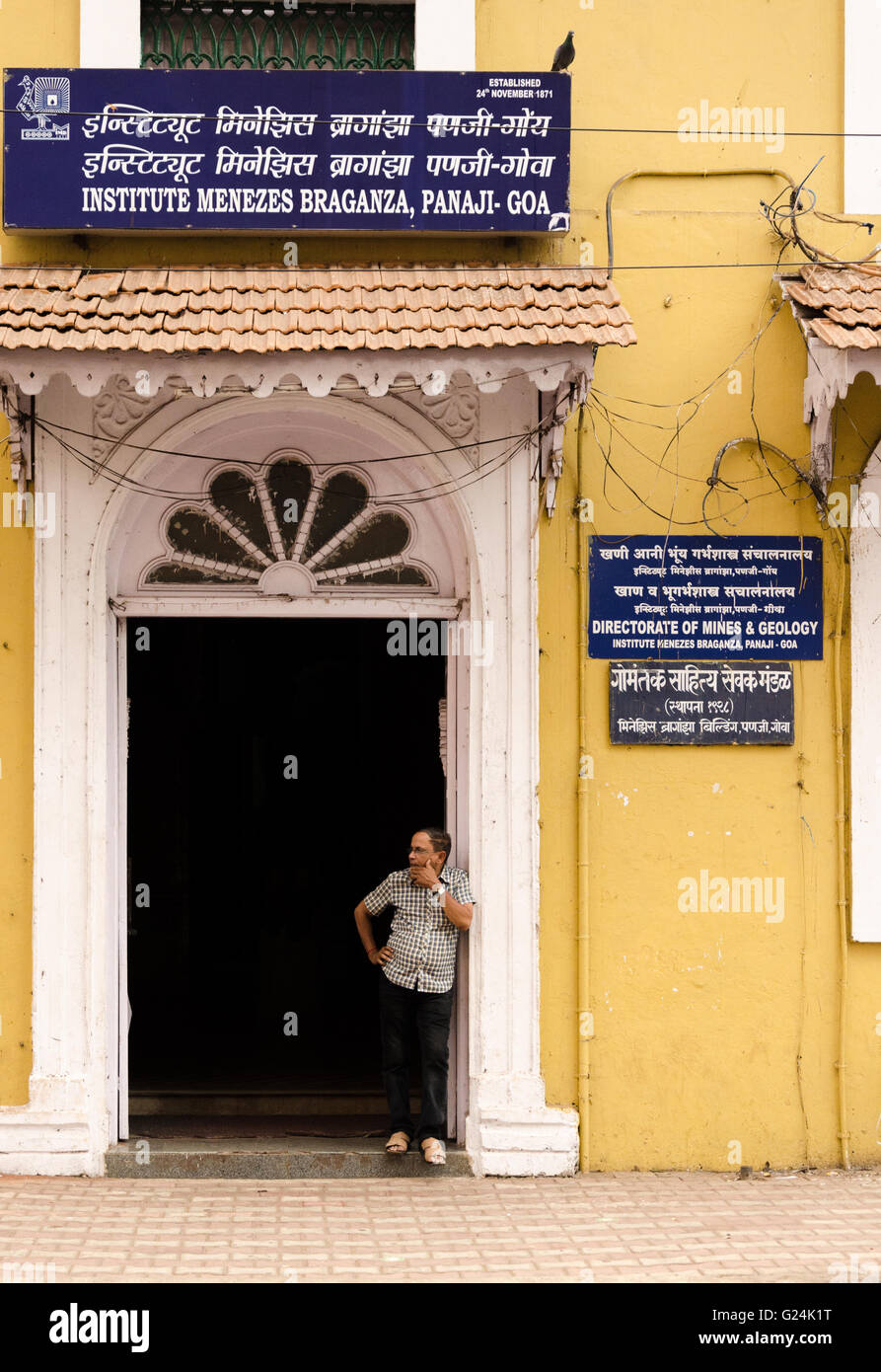 A Goan man standing at the entrance of Institute Menezes Braganza ...