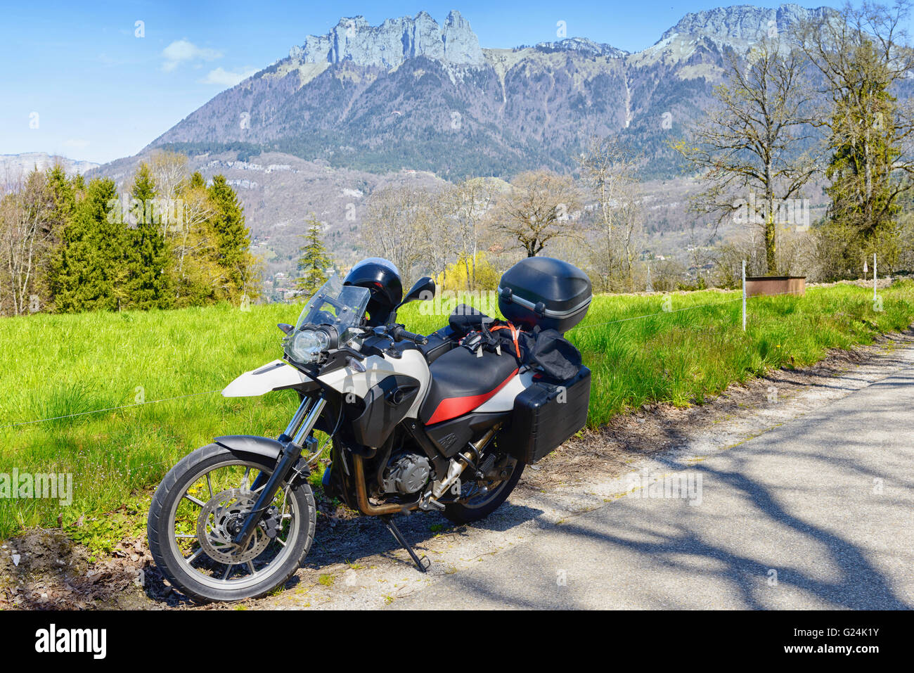 a motorcycle with the mountain in the background Stock Photo - Alamy