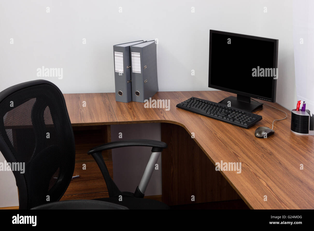 The monitor on a desk at modern office Stock Photo - Alamy