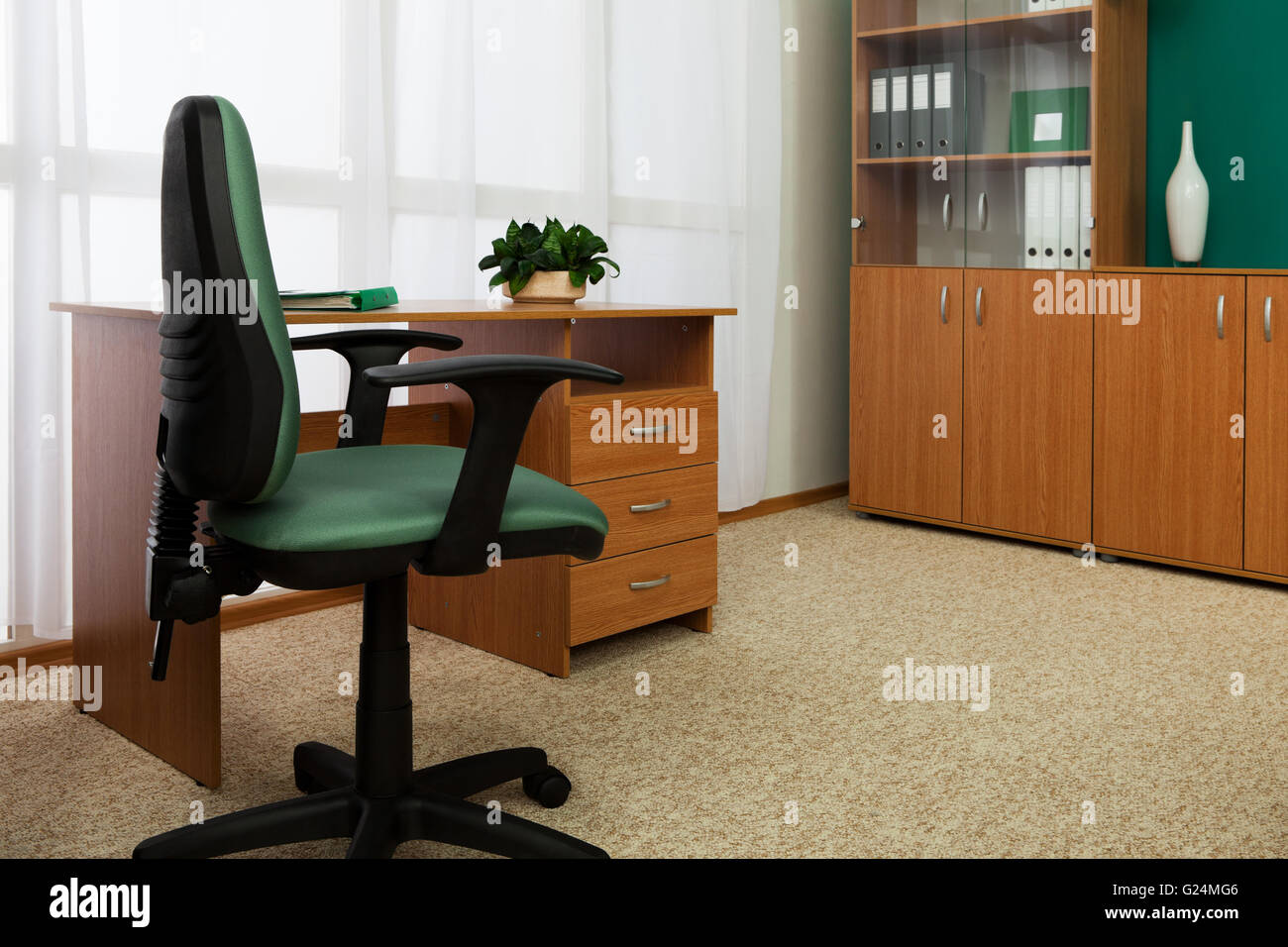 chair and desk by the window in a modern office Stock Photo - Alamy