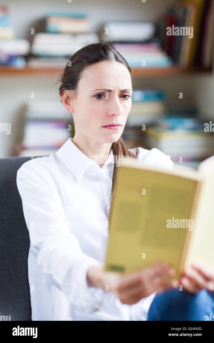 Woman reading a book Stock Photo - Alamy