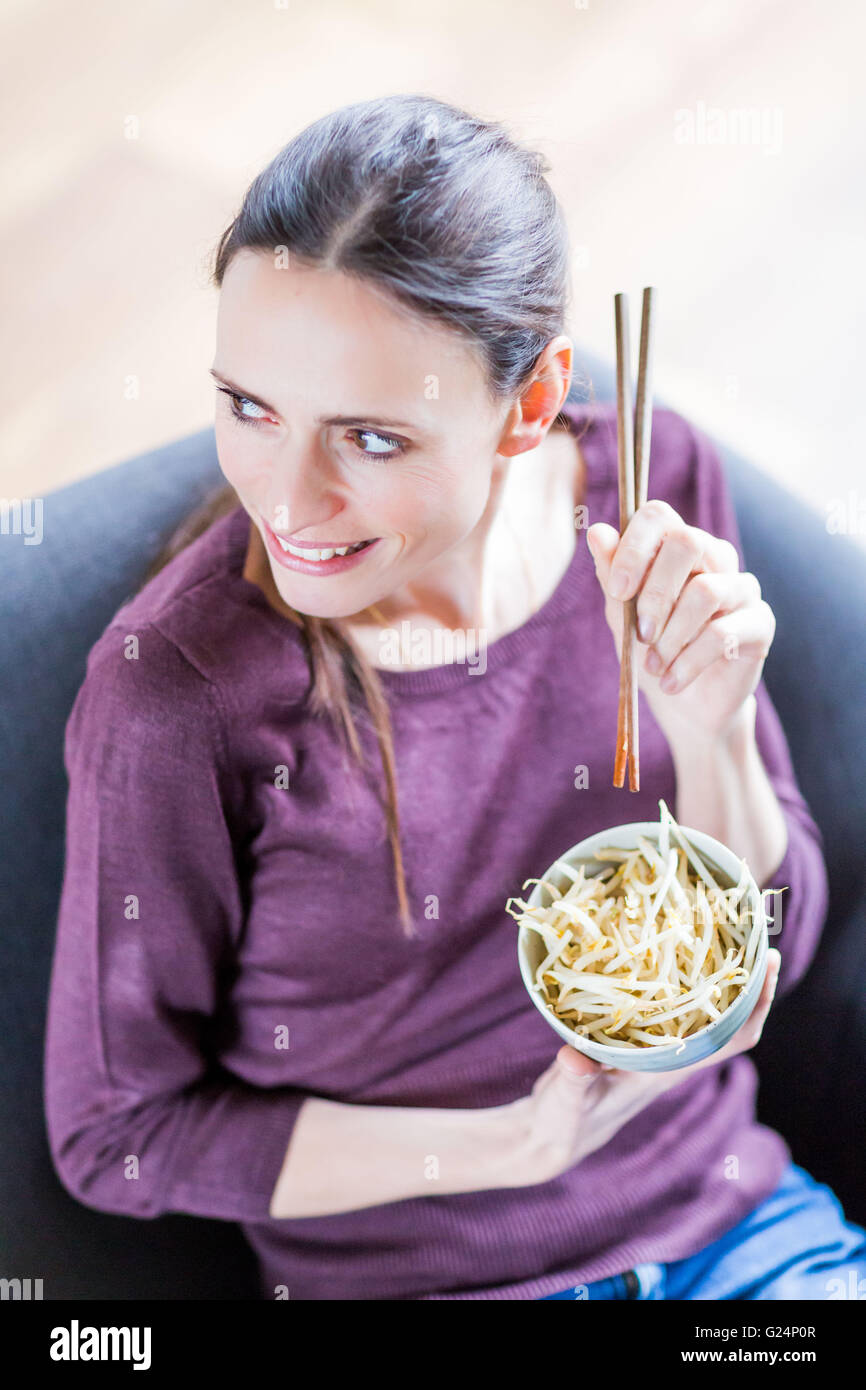 Woman eating sprouts hi-res stock photography and images - Alamy
