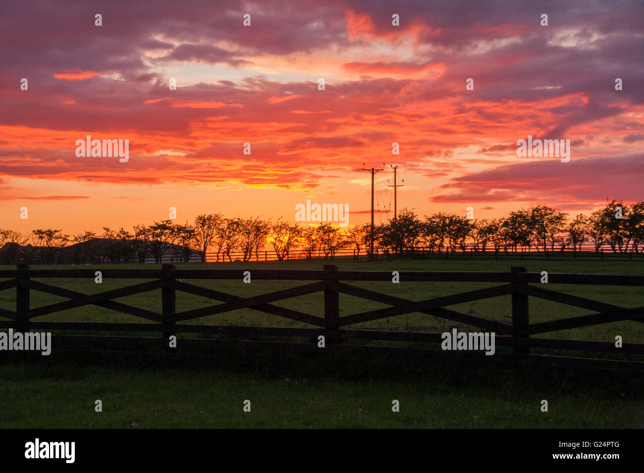 Colourful red and purple skies over Stockton with the sun setting over ...