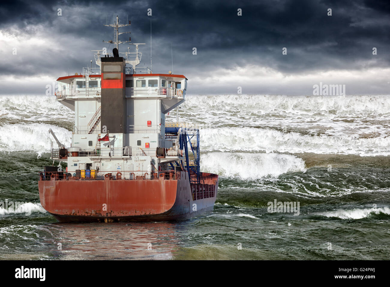 Cargo ship during storm in ocean Stock Photo - Alamy