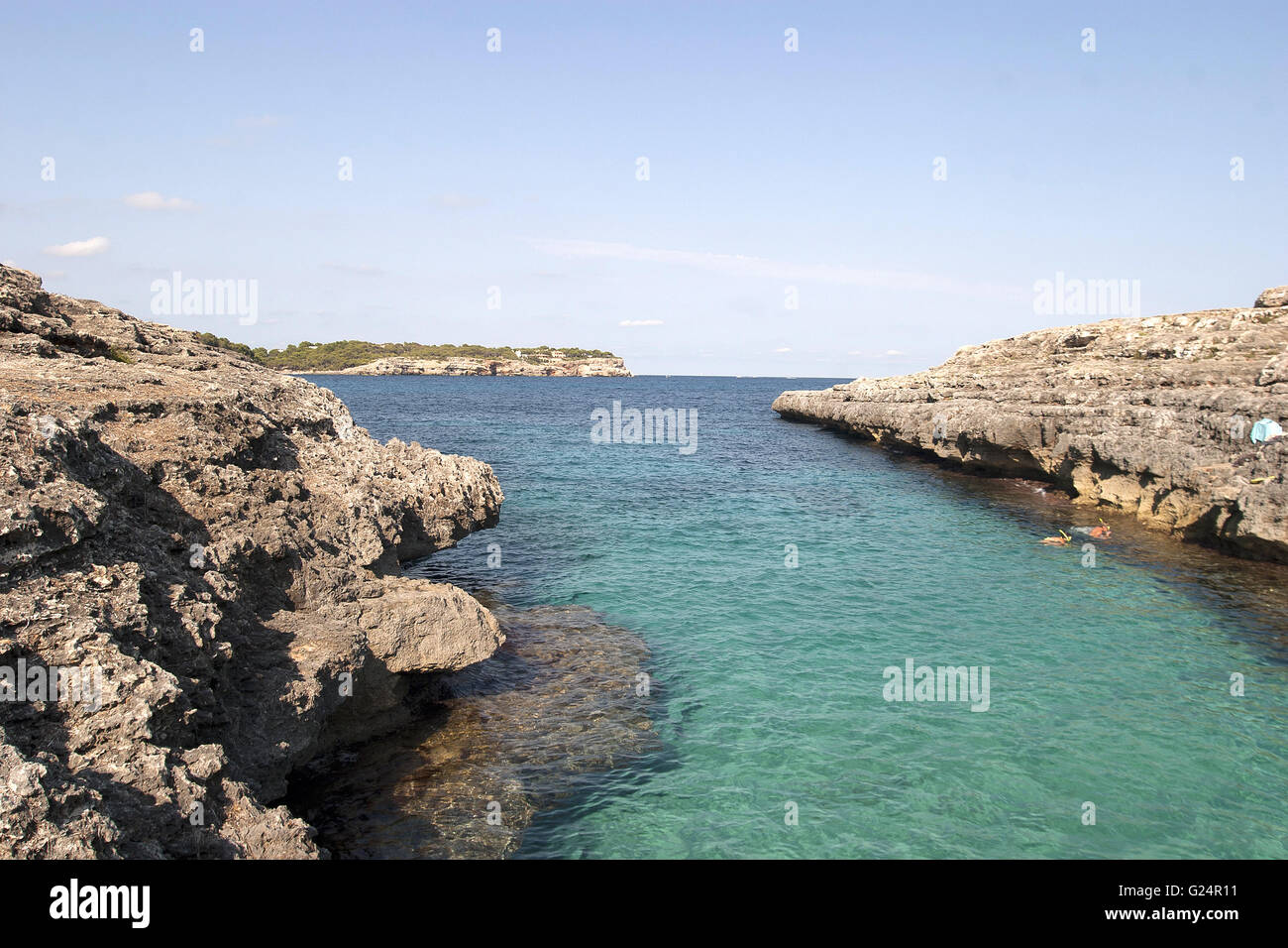 a beautiful view of a rocky seaside cove in Palma de Mallorca, rocks ...