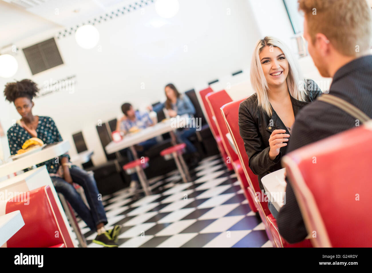 Couple sitting table hi-res stock photography and images - Alamy