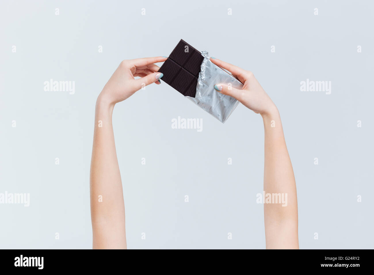 Female hand holding piece chocolate hi-res stock photography and images ...