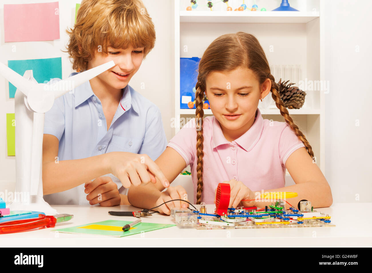 Teenage kids creating wind generator turbine model Stock Photo - Alamy