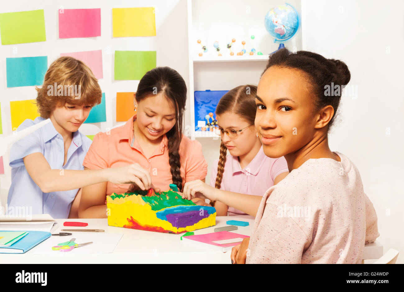 Students learning geography at the classroom Stock Photo - Alamy