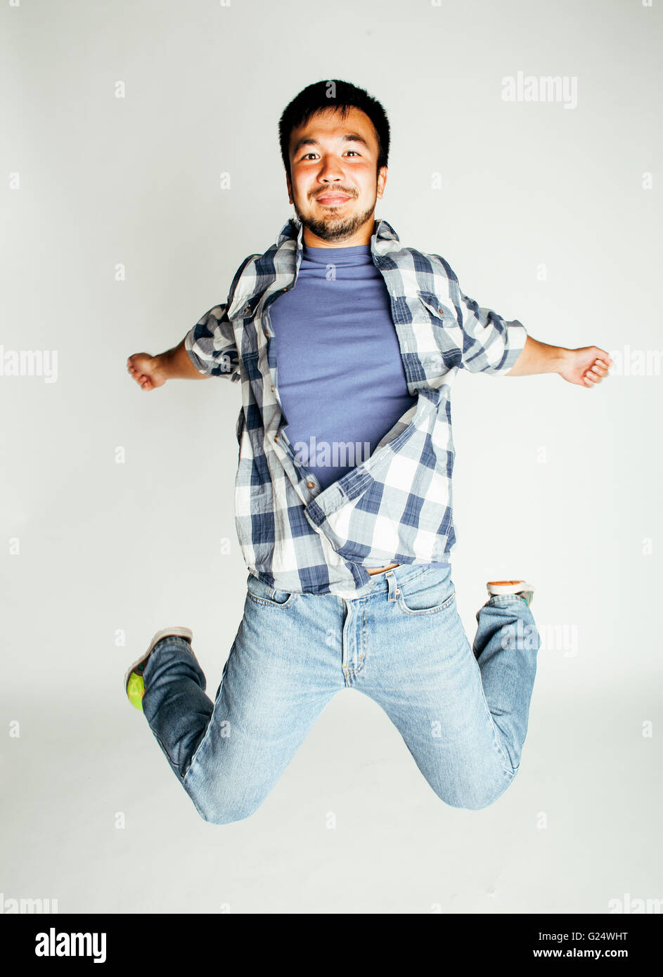 young pretty asian man jumping cheerful against white background ...