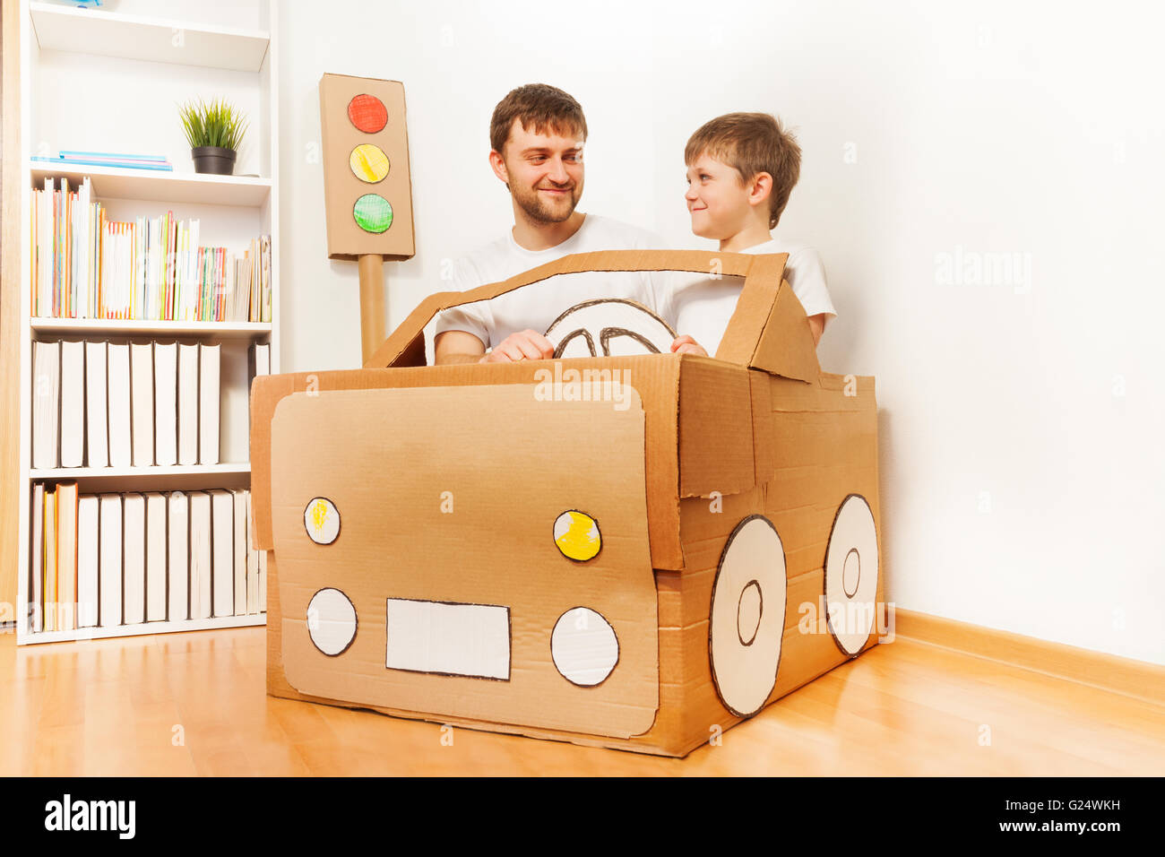 Father and his son driving handmade cardboard car Stock Photo - Alamy