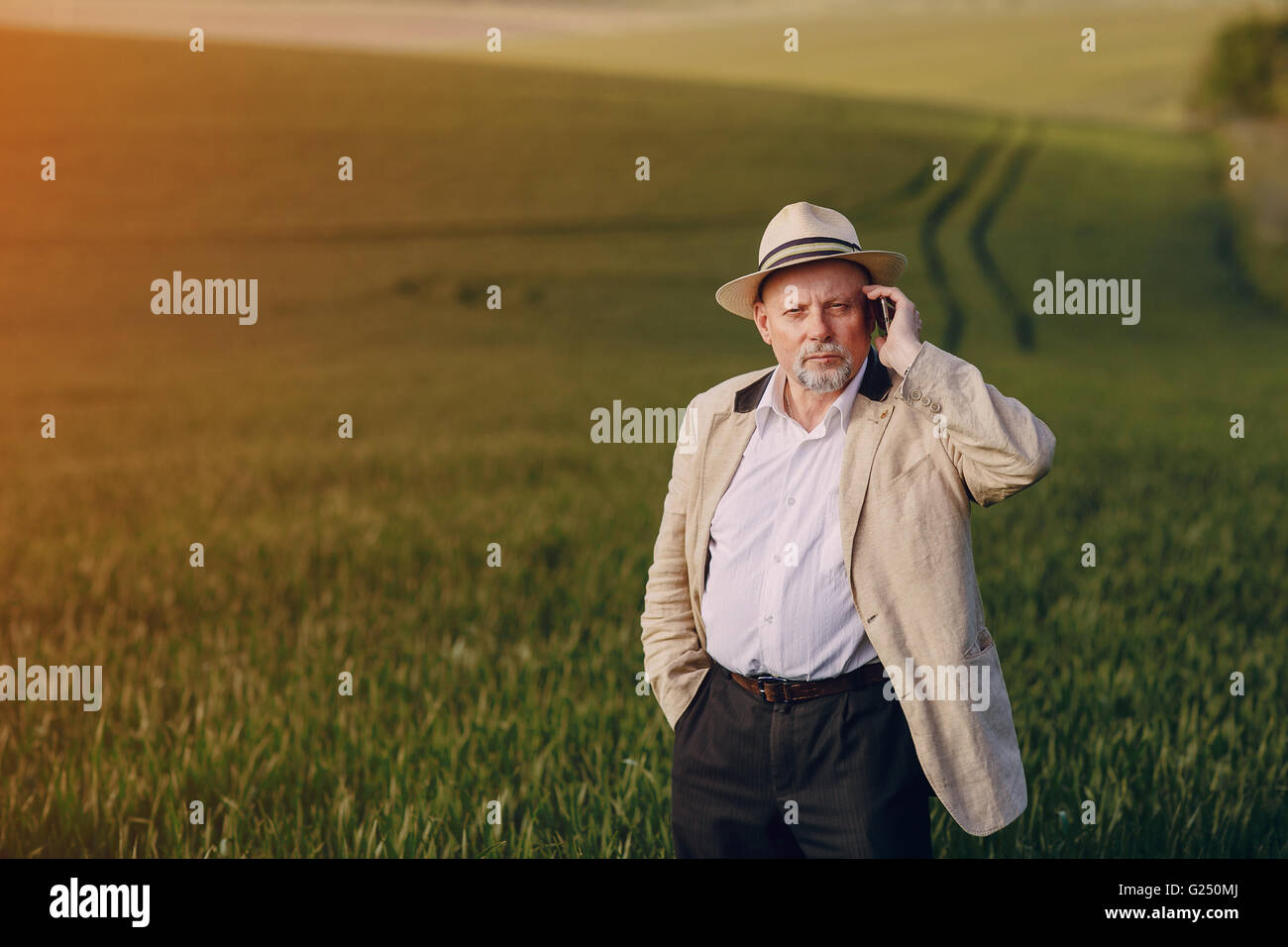 old man in field Stock Photo - Alamy